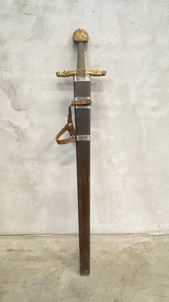 Stylized medieval sword with cross-iron and lion decoration, with ...